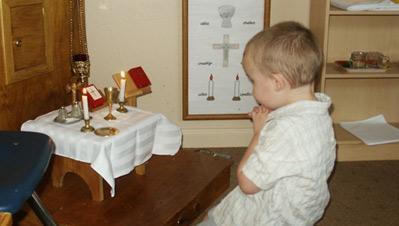 CGS boy praying altar child